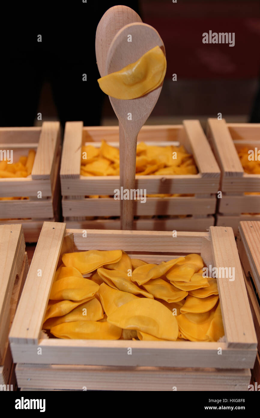 Ravioli Italian Pasta in Wooden Box with Brown Ladle Stock Photo - Alamy