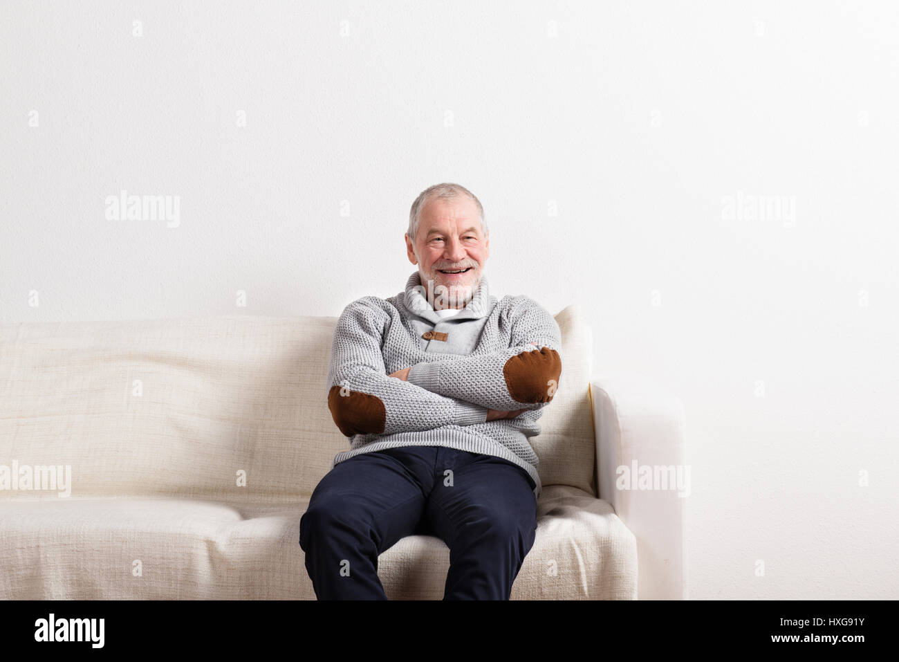 Resting arms on sofa hi-res stock photography and images - Alamy