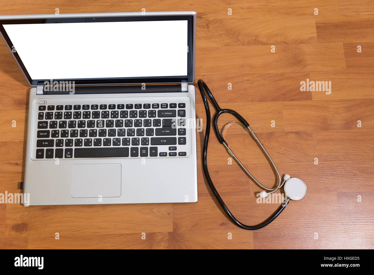 Medical stethoscope and laptop computer lying at physician doctor 's ...