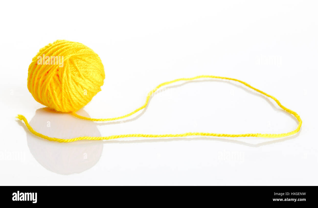 Yellow wool yarn ball isolated on white background Stock Photo - Alamy