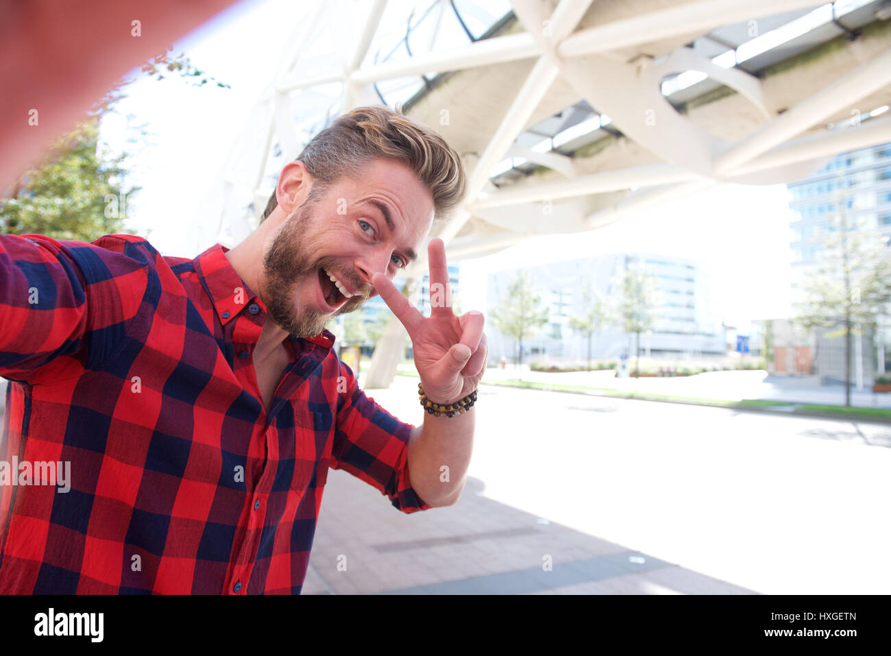 Man making peace sign hi-res stock photography and images - Alamy