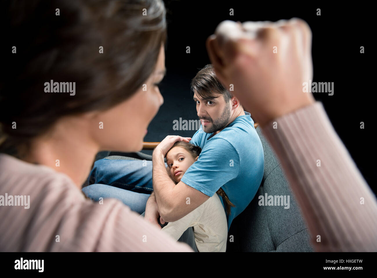 father protecting daughter from aggressive mother, family violence ...