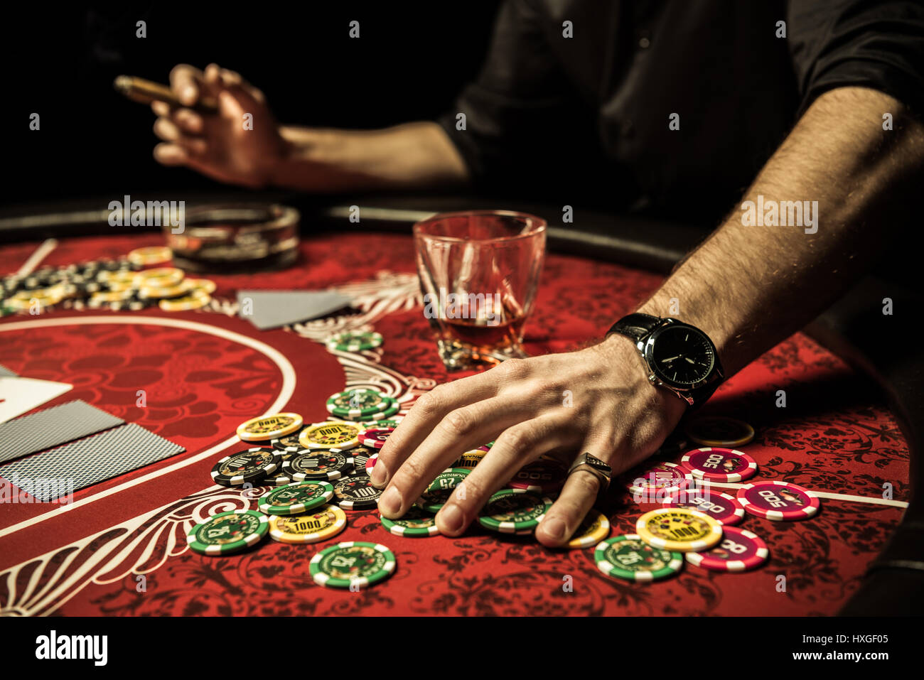 People sitting poker table playing hi-res stock photography and images ...