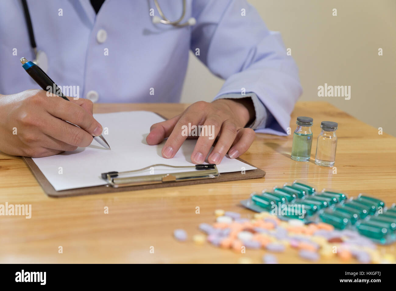 Doctor working in hospital writing RX prescription, Healthcare and ...