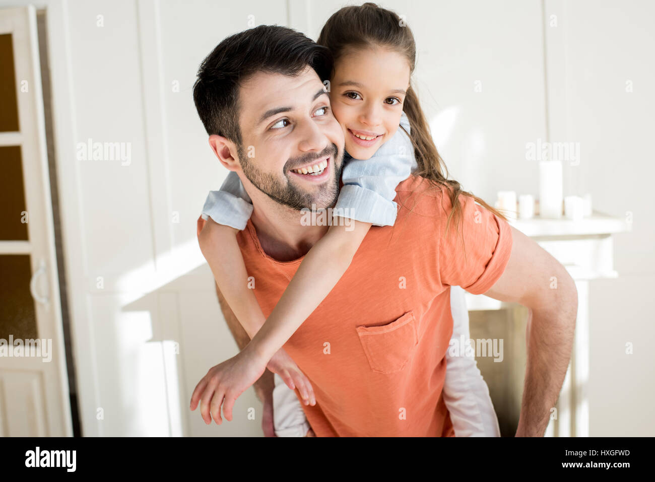 portrait of cheerful father holding daughter Stock Photo - Alamy