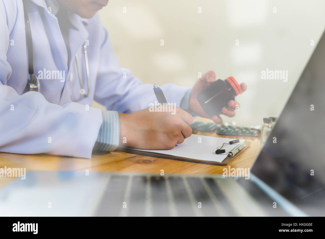 Doctor working in hospital writing RX prescription, Healthcare and ...