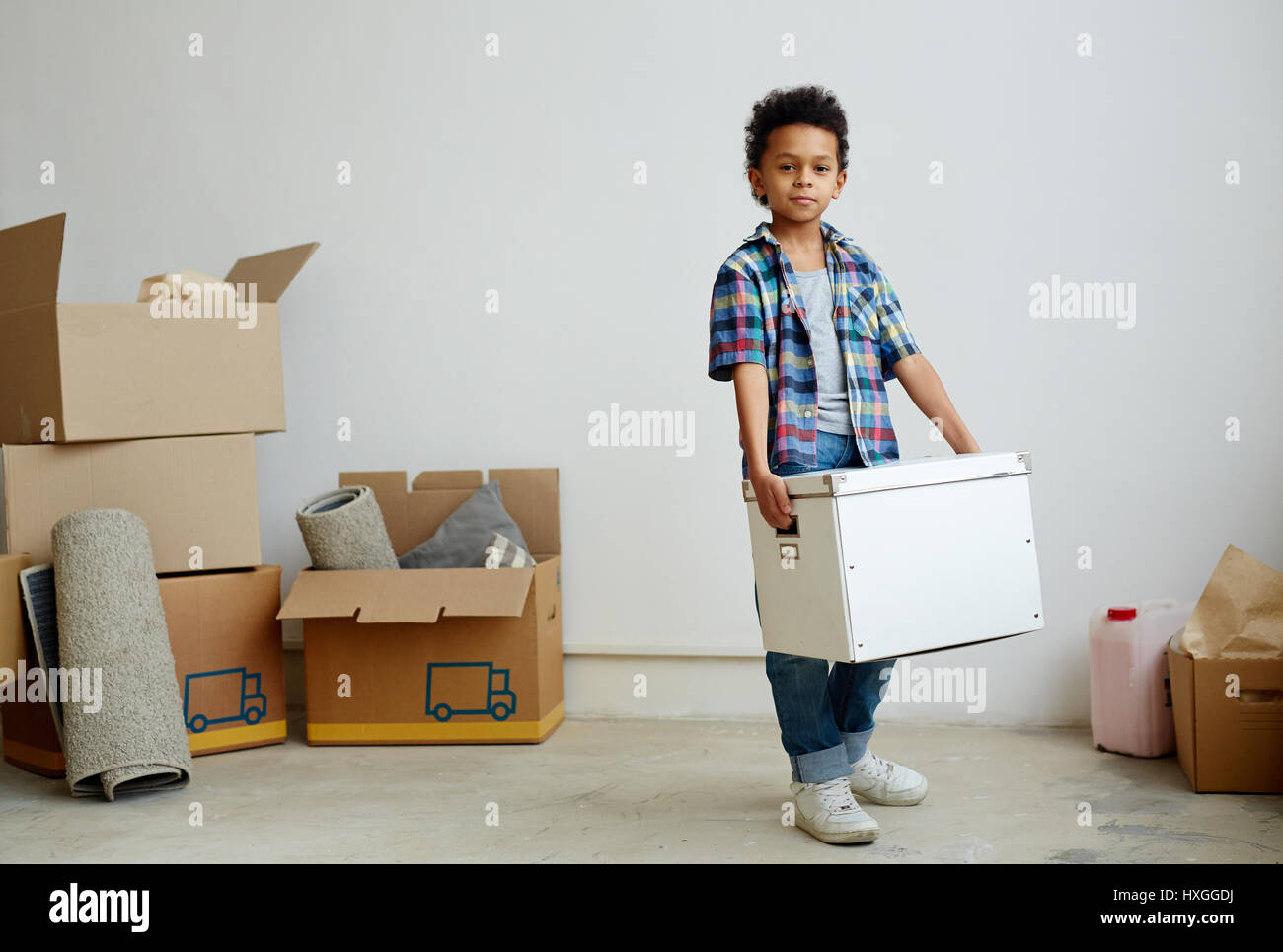 African boy carrying box hi-res stock photography and images - Alamy