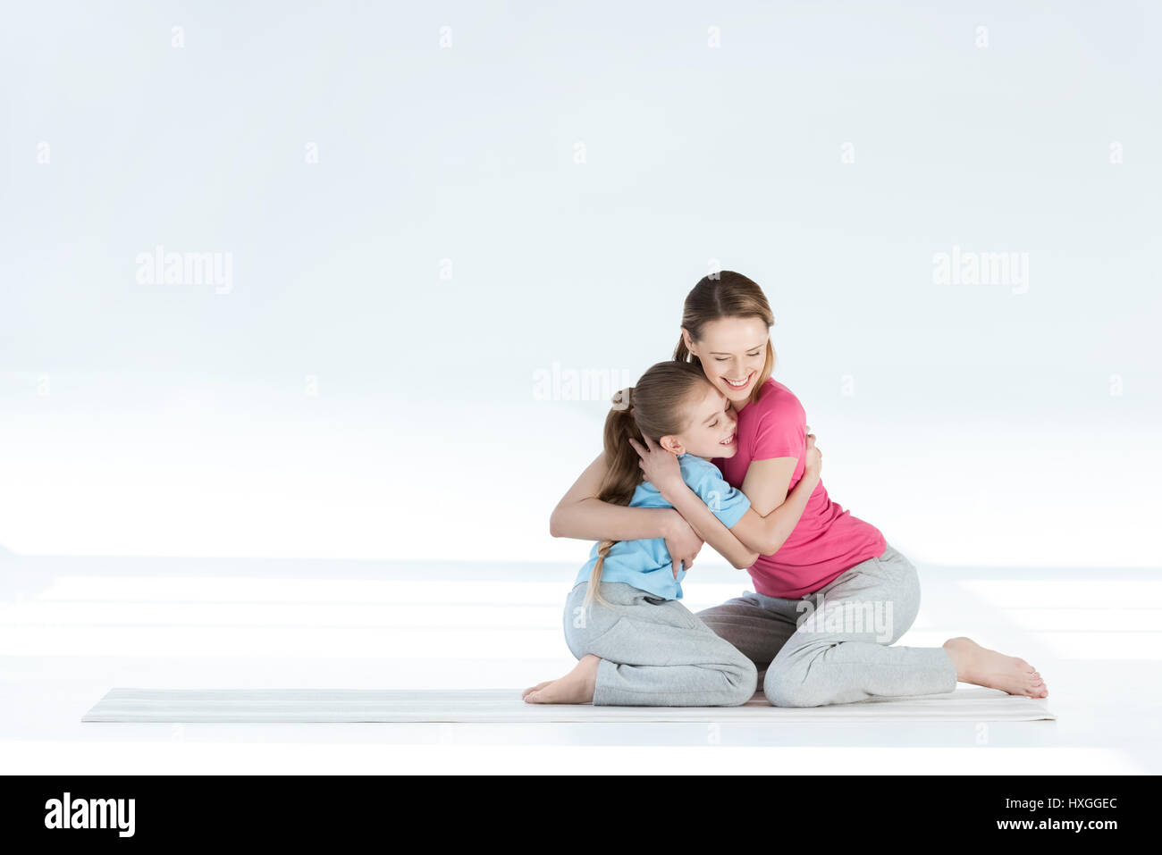 Sporty girl sitting mat hi-res stock photography and images - Alamy