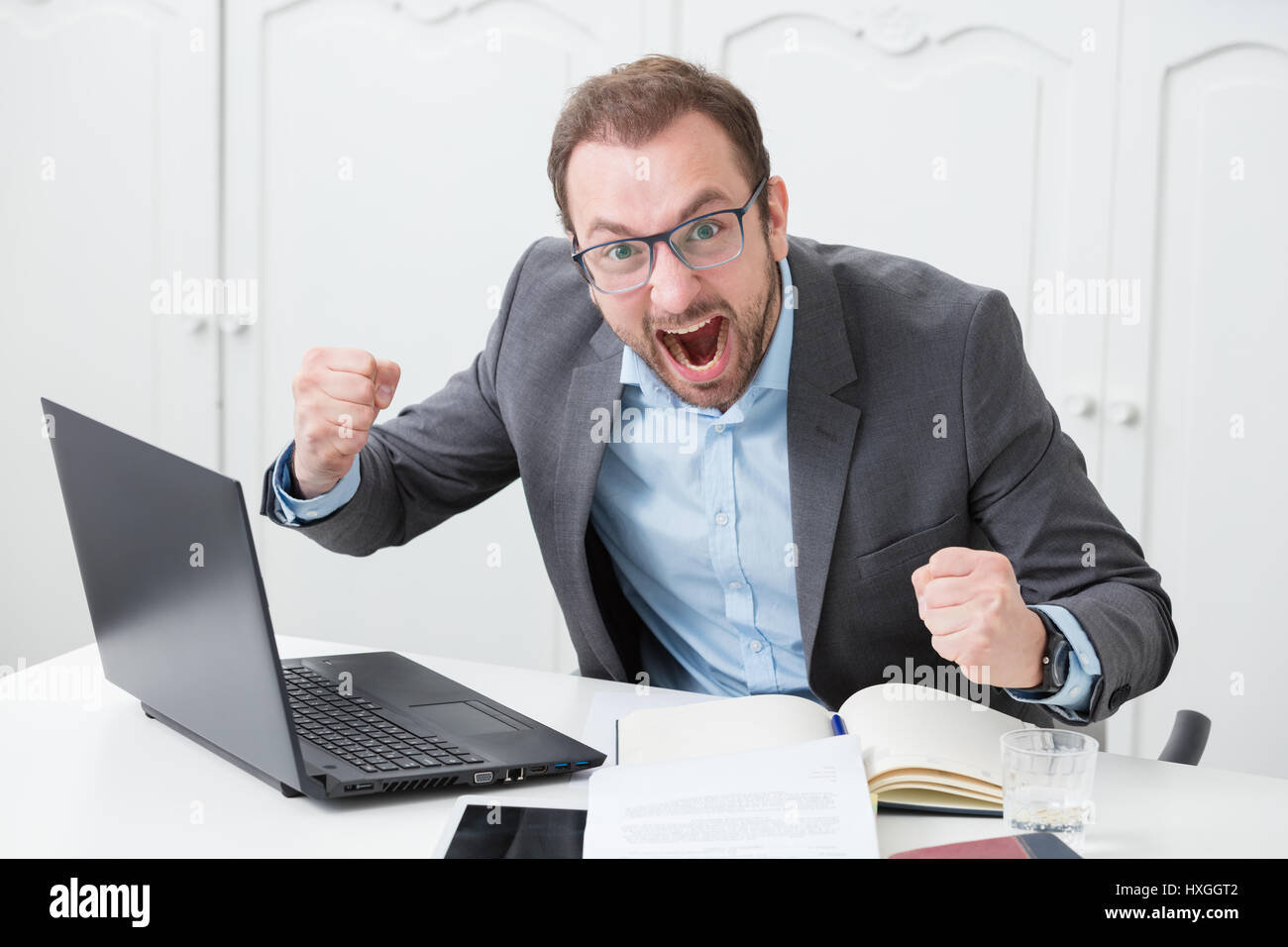 Angry businessman yelling Stock Photo - Alamy