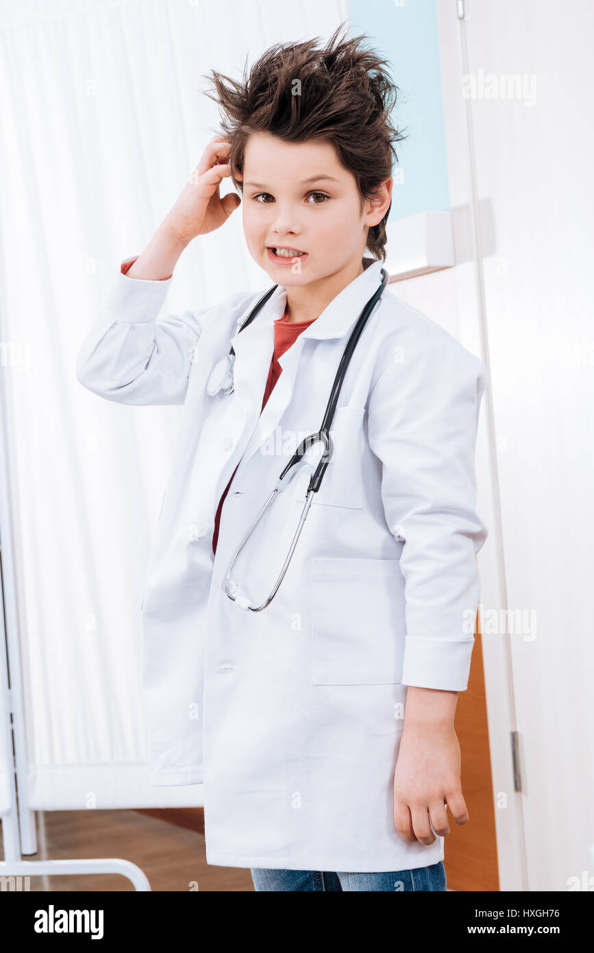 portrait of confused boy doctor with stethoscope in hospital Stock ...