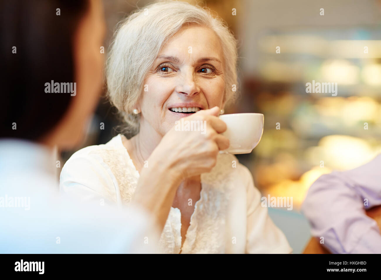 Mature woman drinking tea hi-res stock photography and images - Alamy
