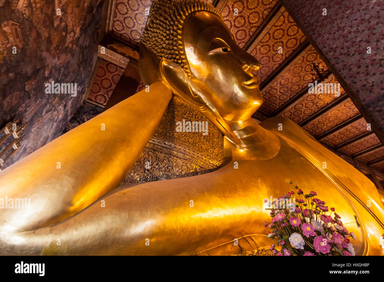 Golden big Buddha face in Wat Pho , Bangkok , Thailand. Grand Palace ...