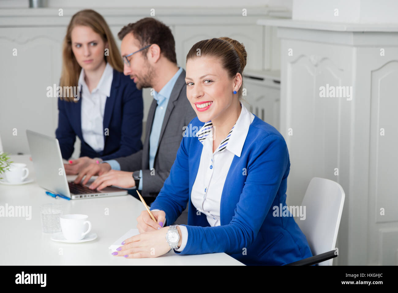 Businesspeople sitting taking notes woman hi-res stock photography and ...