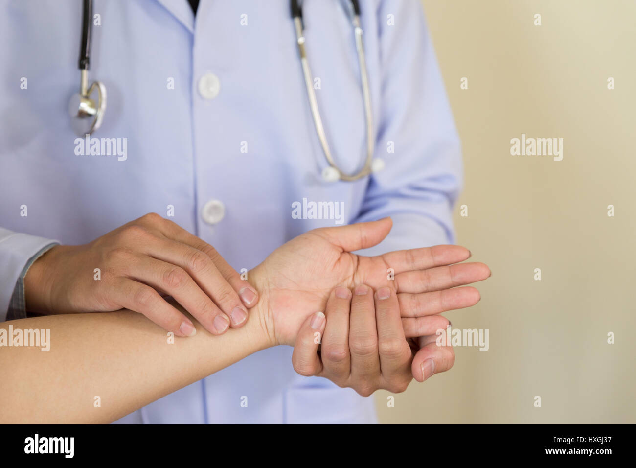doctor measuring pulse of his senior patient. healthcare and medical ...