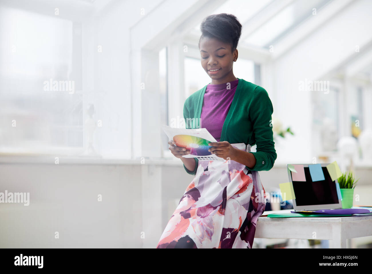 Attractive young woman looking at color diagram Stock Photo - Alamy