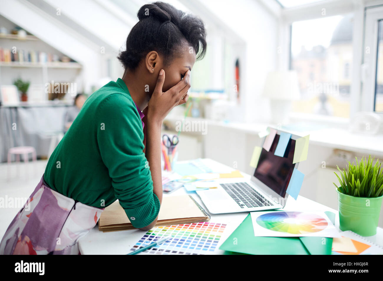Stressed fashion-designer thinking over new project Stock Photo - Alamy