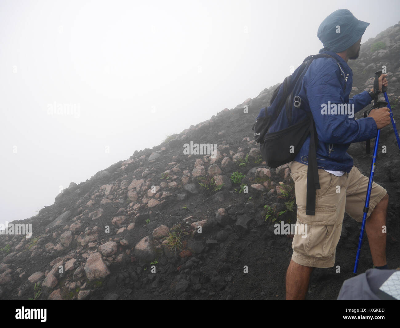 GUide is showing and leading a way using short cut to the top of the ...