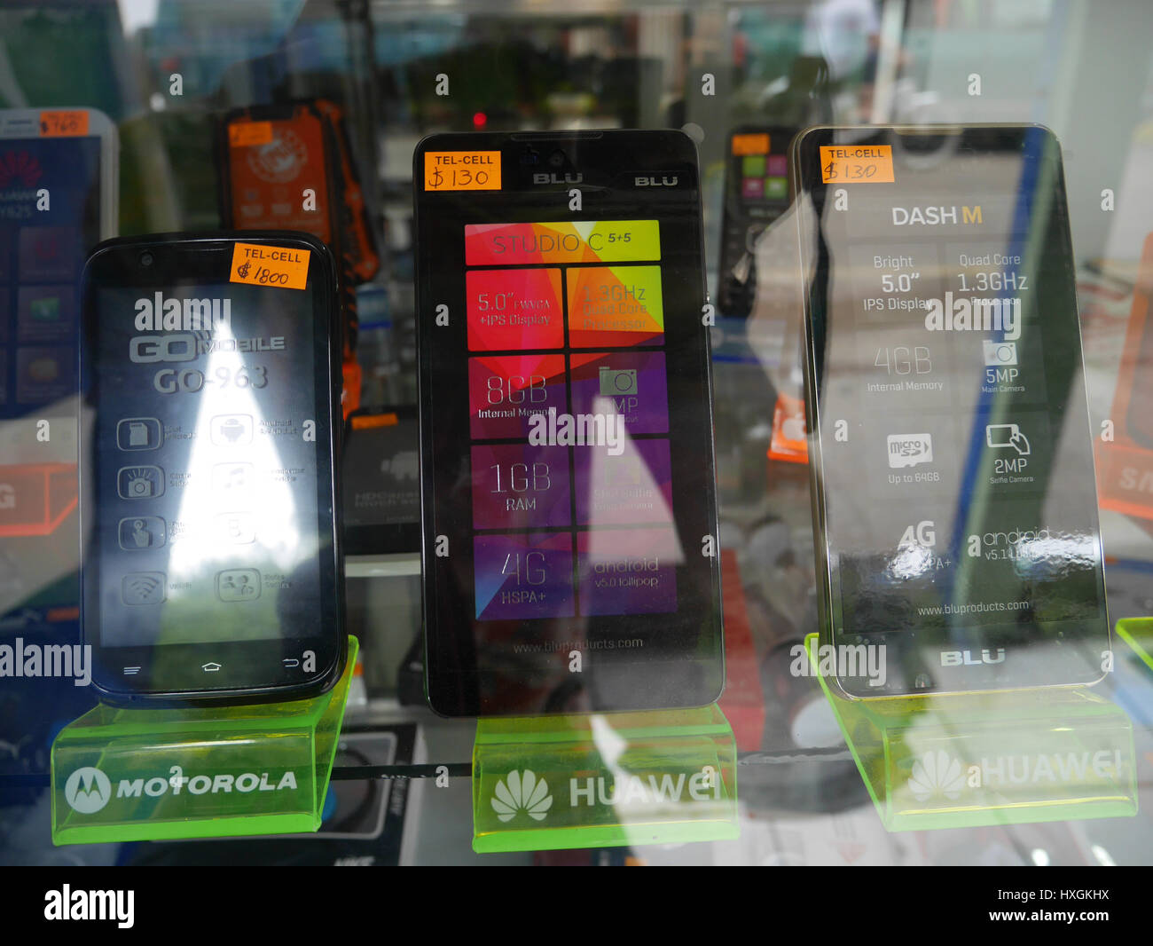 Mobile phone store under the glass with a lot of old smartphones Stock ...