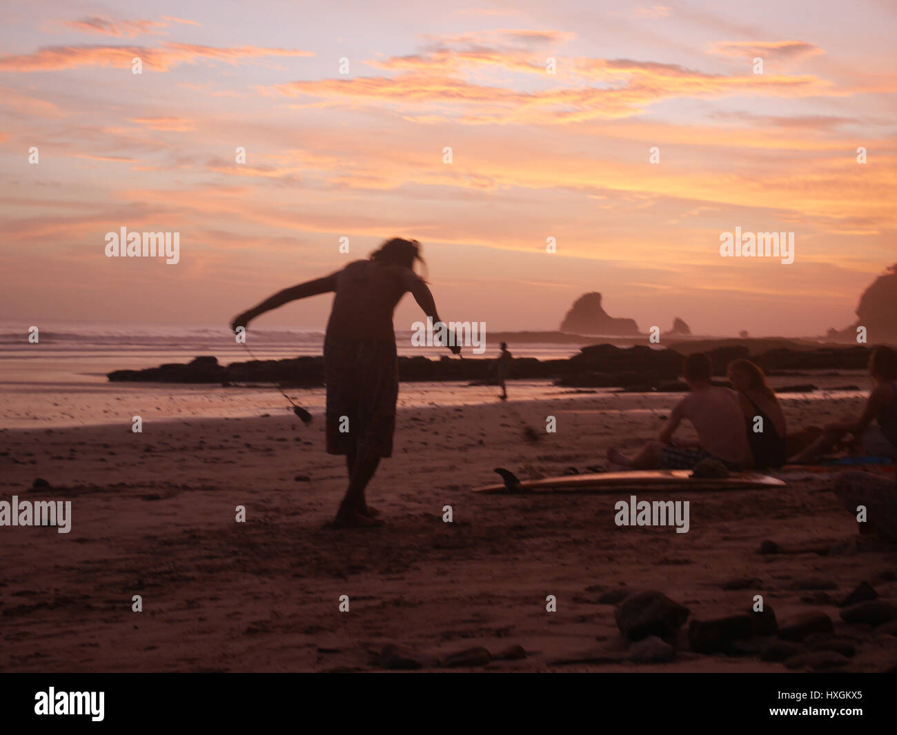 Indian men is dancing on a beach during sun his traditional dance with ...
