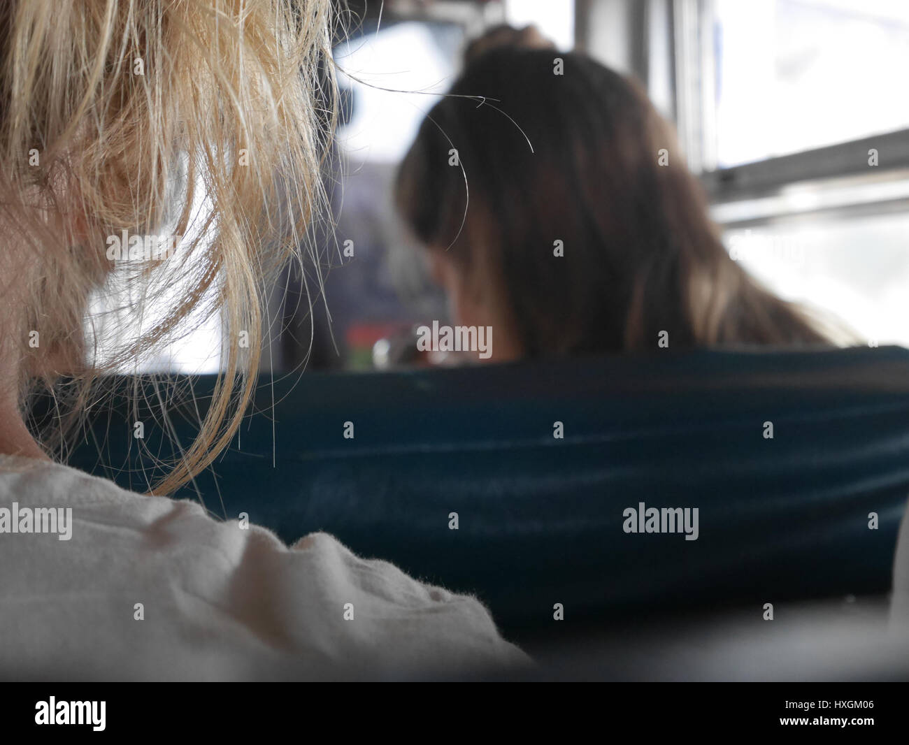 People sitting inside the chicken bus waiting for their cheap and ...