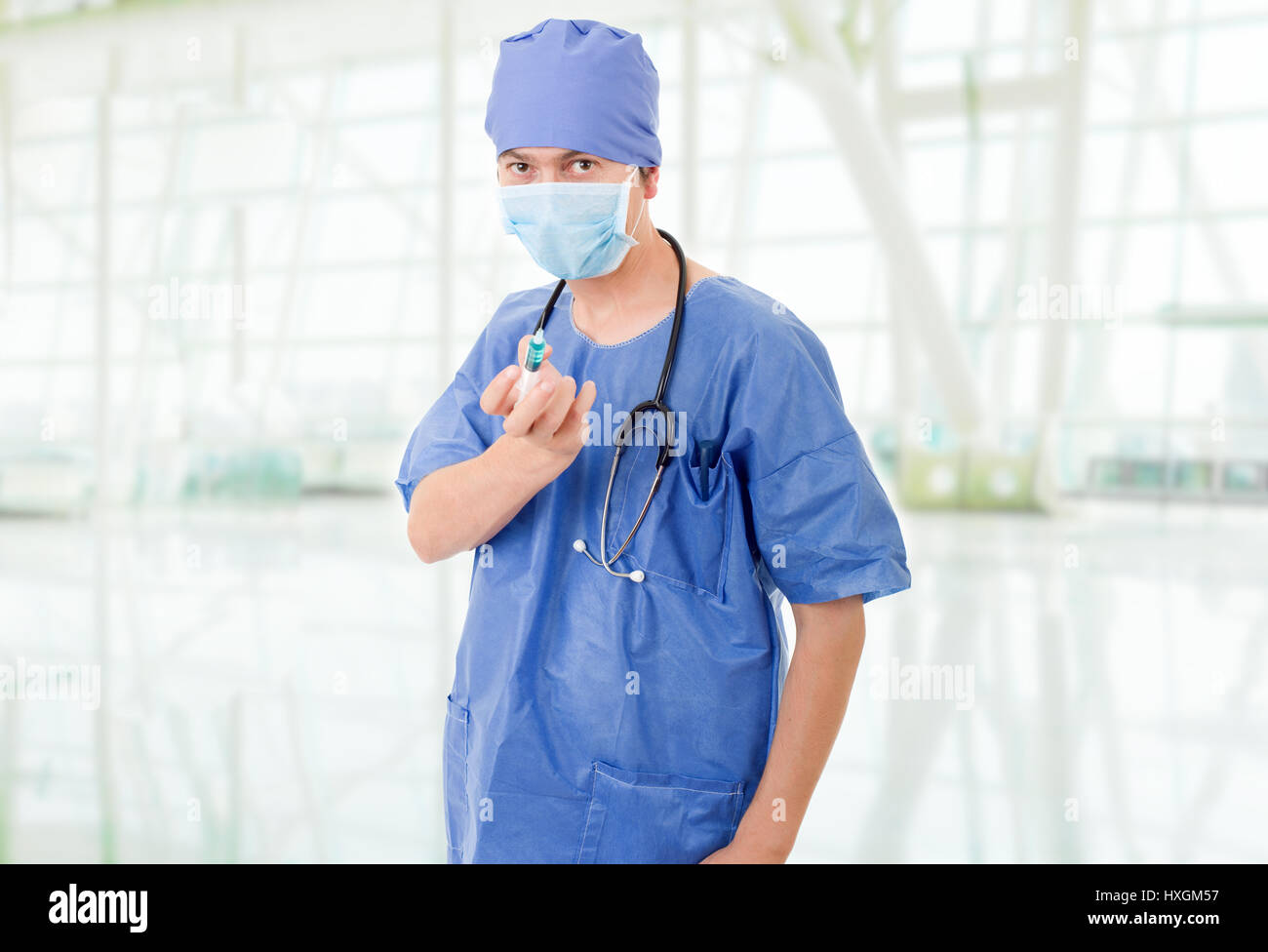 silly doctor with a syringe at the hospital Stock Photo - Alamy