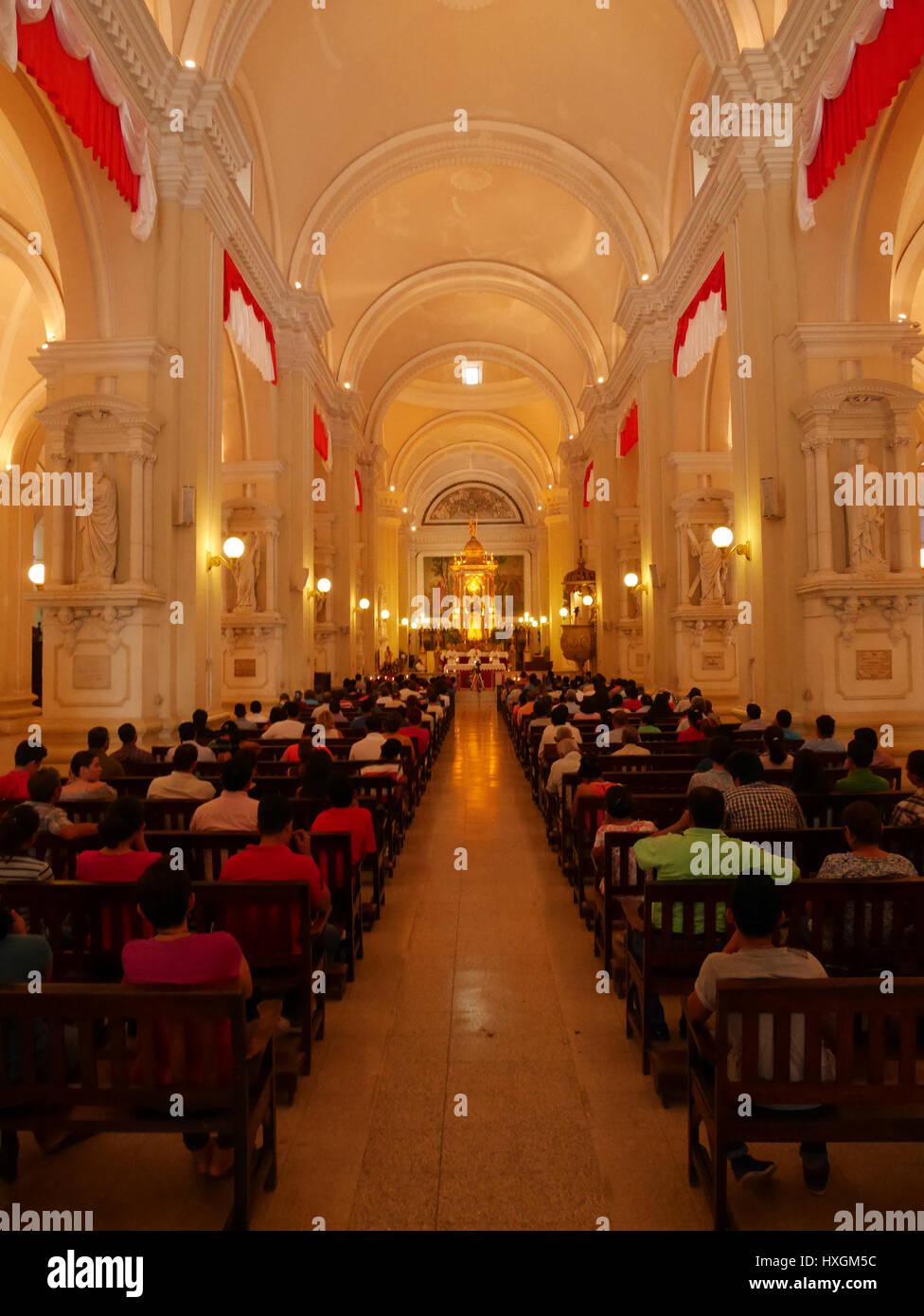 Inside the church during mass in Nicaragua, crowded people praying ...
