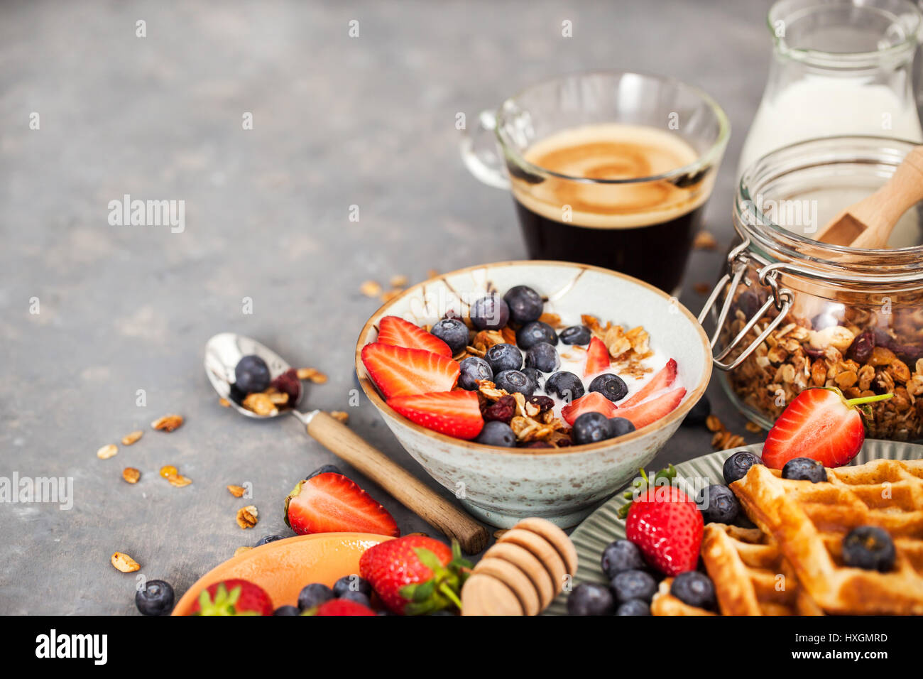 Healthy breakfast table with cereal granola, milk, fresh berries ...