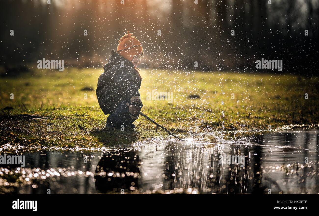 Small boy playing outdoor at early spring. happy childhood Stock Photo ...