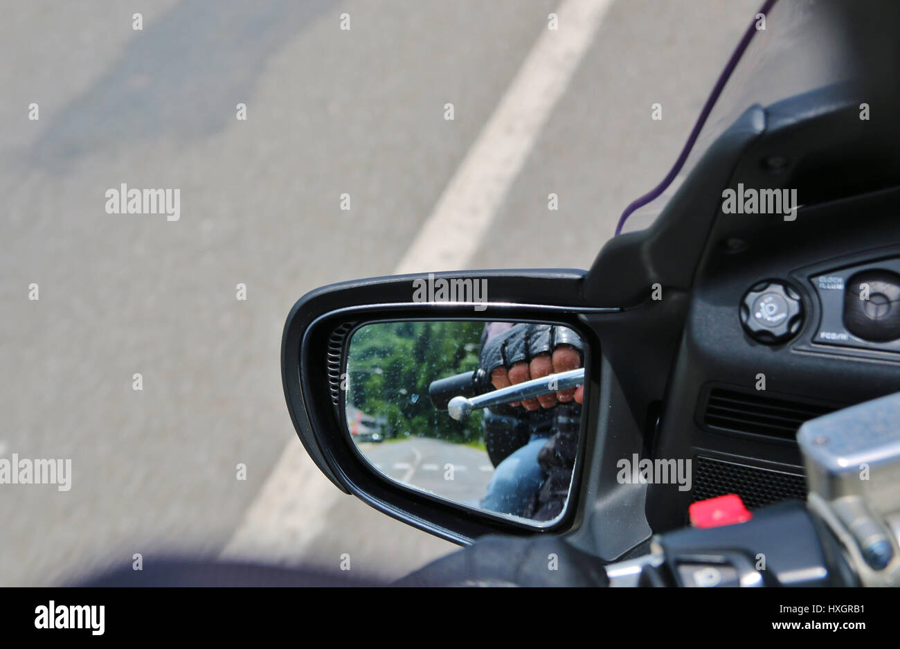 Reflection of the Hand rider on the handlebars Stock Photo - Alamy