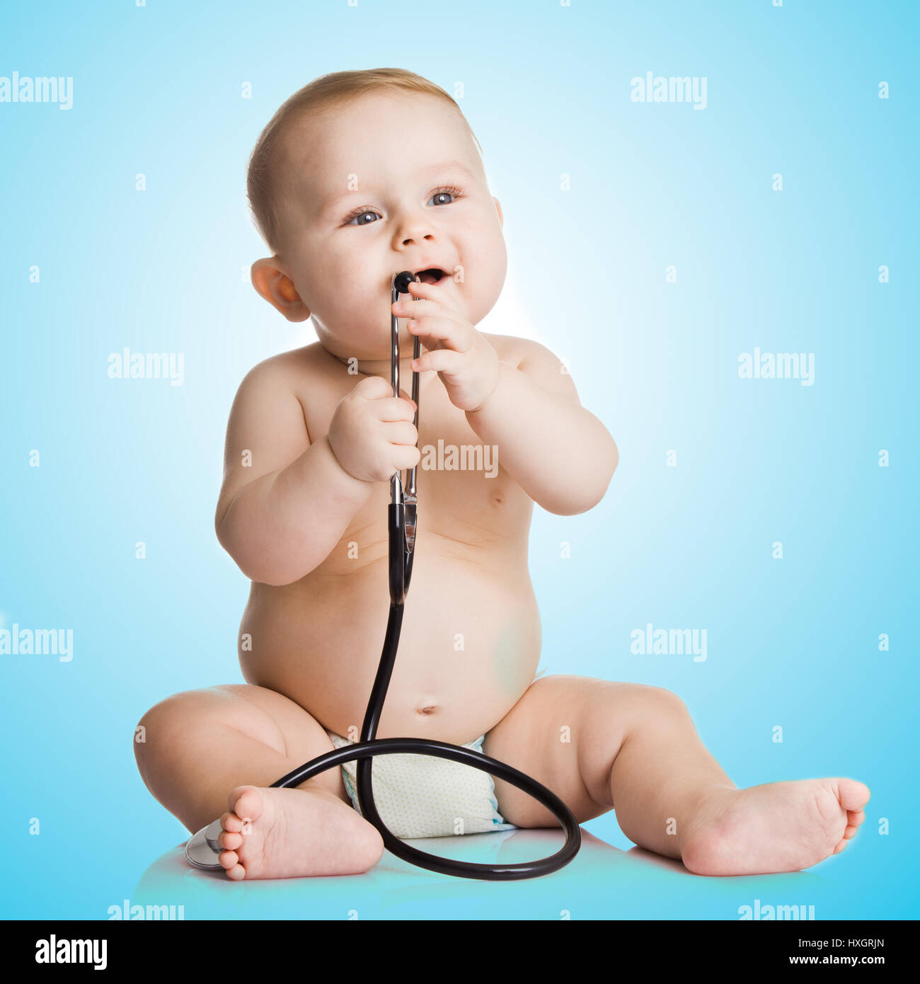 Adorable Baby Boy with stethoscope on blue background Stock Photo - Alamy
