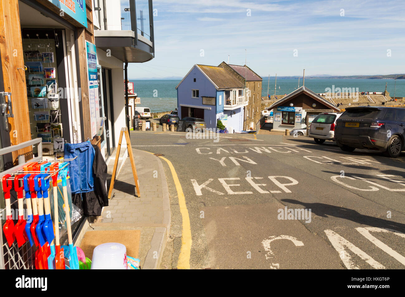 Tourist shops along the seafront in the small coastal town of New Quay ...