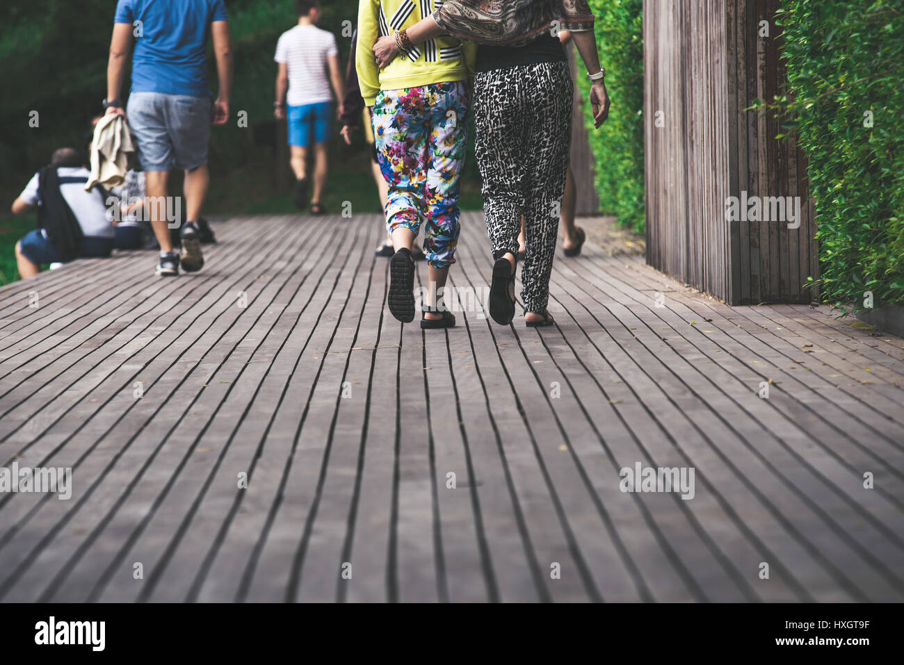 Women walking in the boardwalk Stock Photo - Alamy