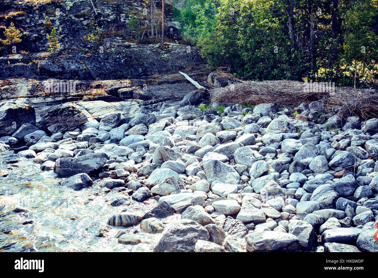 wild north nature landscape. lot of rocks on lake shore Stock Photo - Alamy