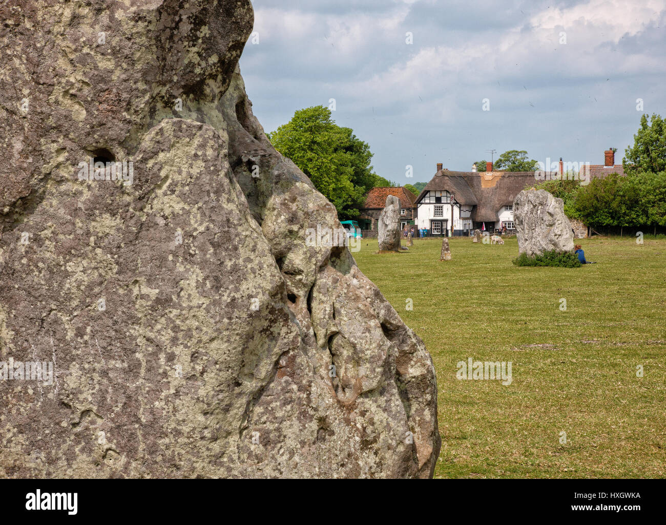 Sarsen standing stones of Avebury stone circles with houses of the ...
