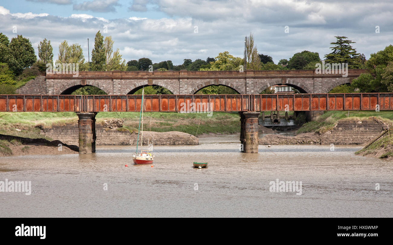 Rail and road bridges over the river Trym as it enters the river Avon ...