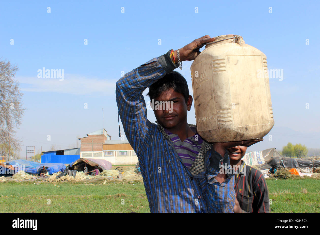 A group of non-local workers from Rajasthan busy in making brooms to ...