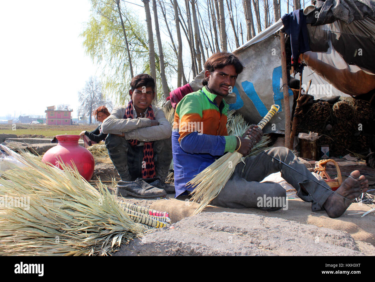 A group of non-local workers from Rajasthan busy in making brooms to ...