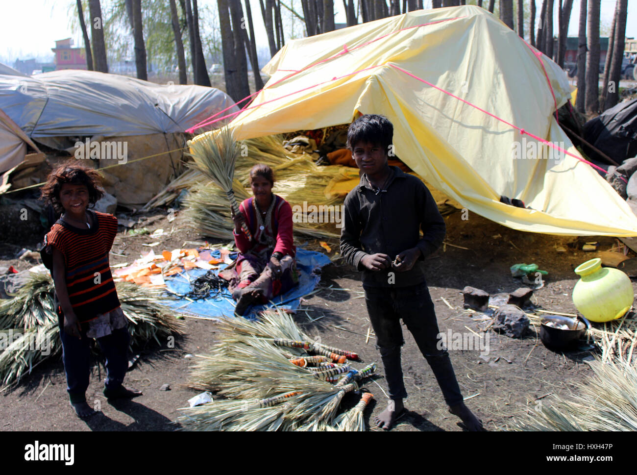 A group of non-local workers from Rajasthan busy in making brooms to ...