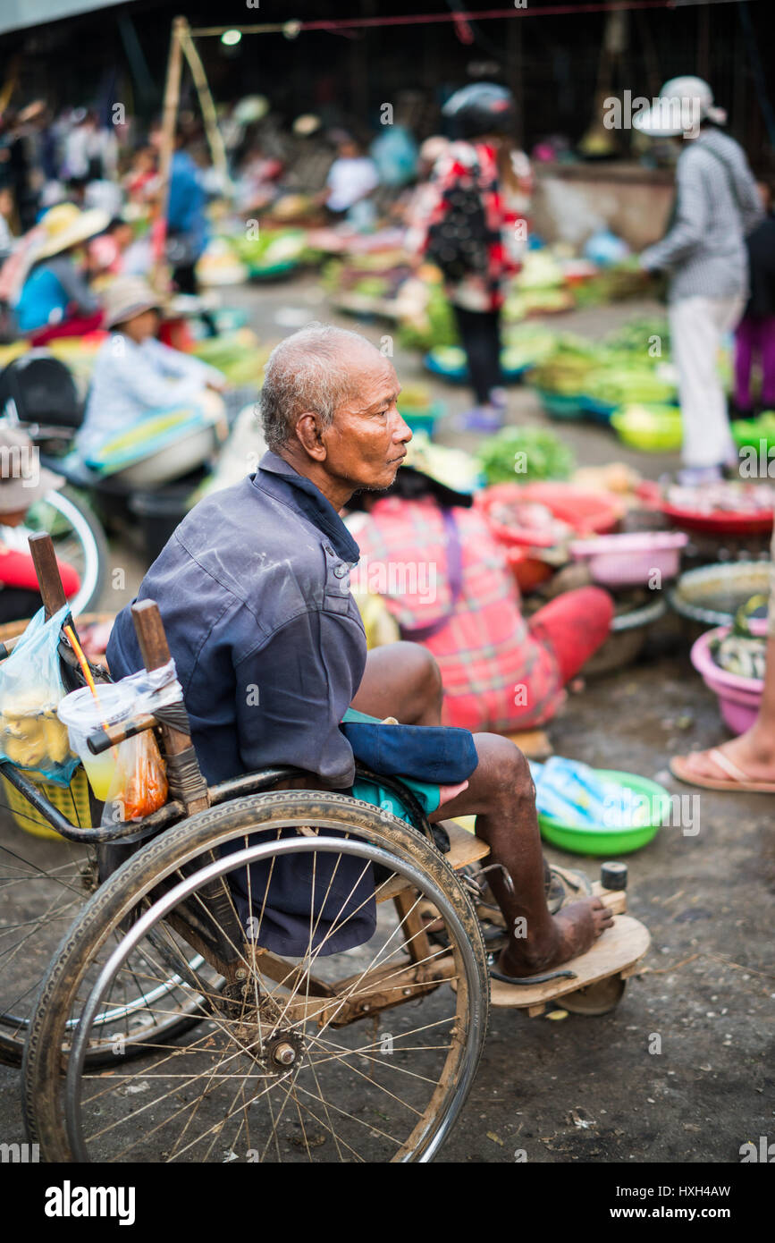 Cripple on a wheelchair, Local Market, Battambang, Cambodia, Asia Stock ...