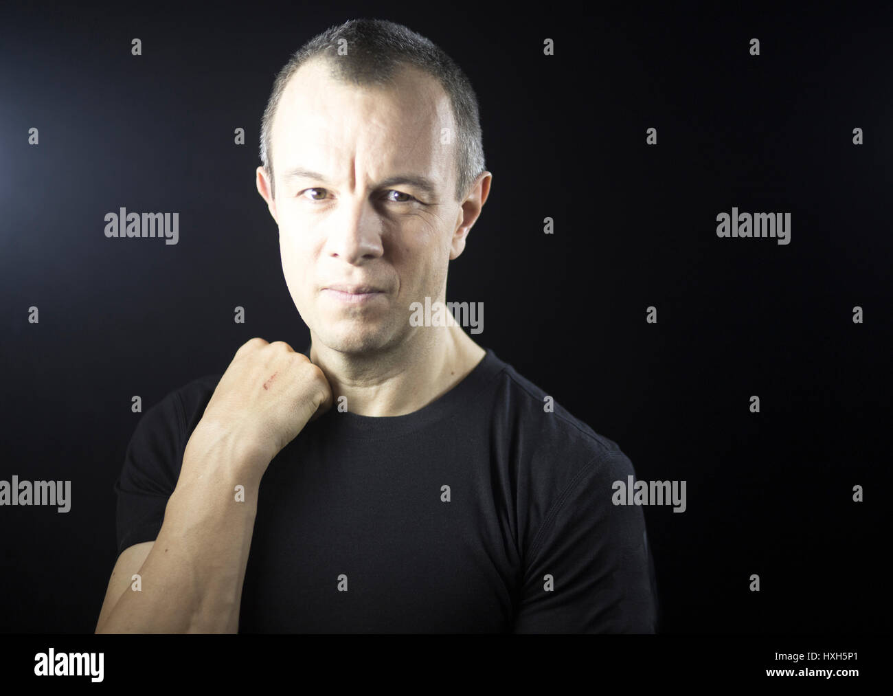 Attractive handsome slim healthy man aged in 40's in black t-shirt ...