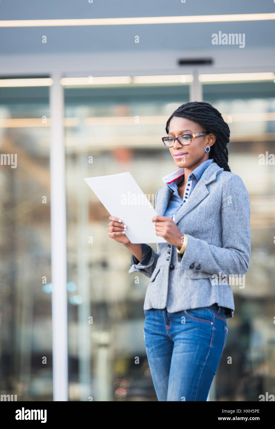 Checking her important notes folder Stock Photo - Alamy