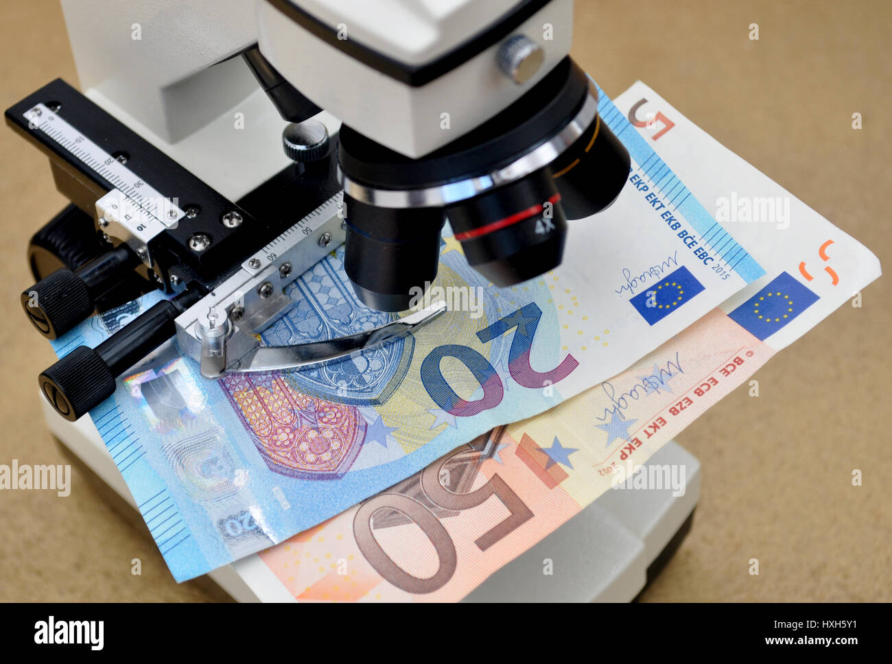 Economy under microscope hi-res stock photography and images - Alamy