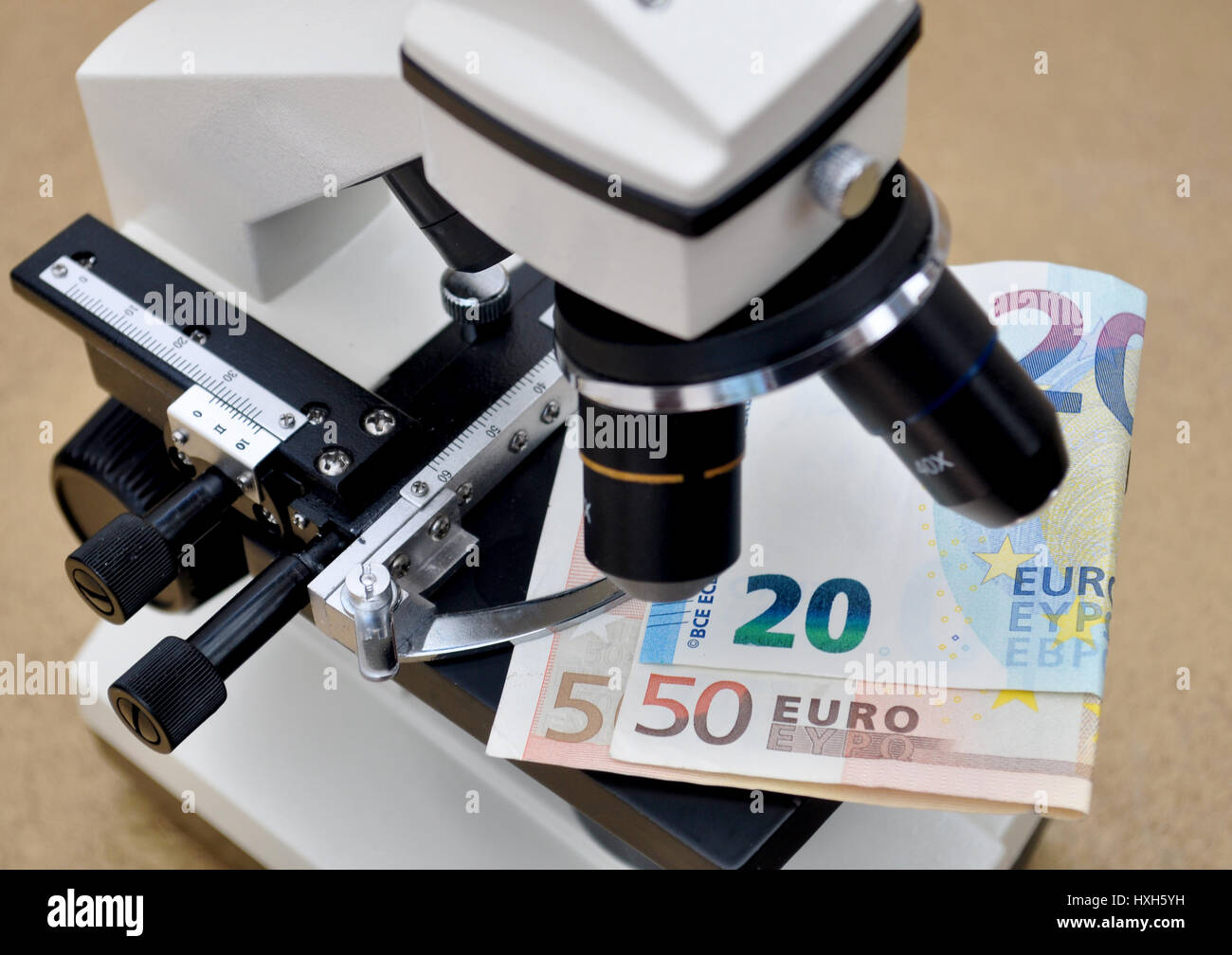 Economy under microscope hi-res stock photography and images - Alamy