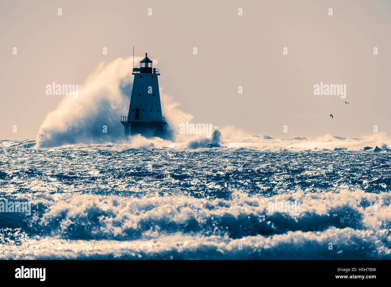 Wind whipped Lake Michigan crashing into the north break wall ...
