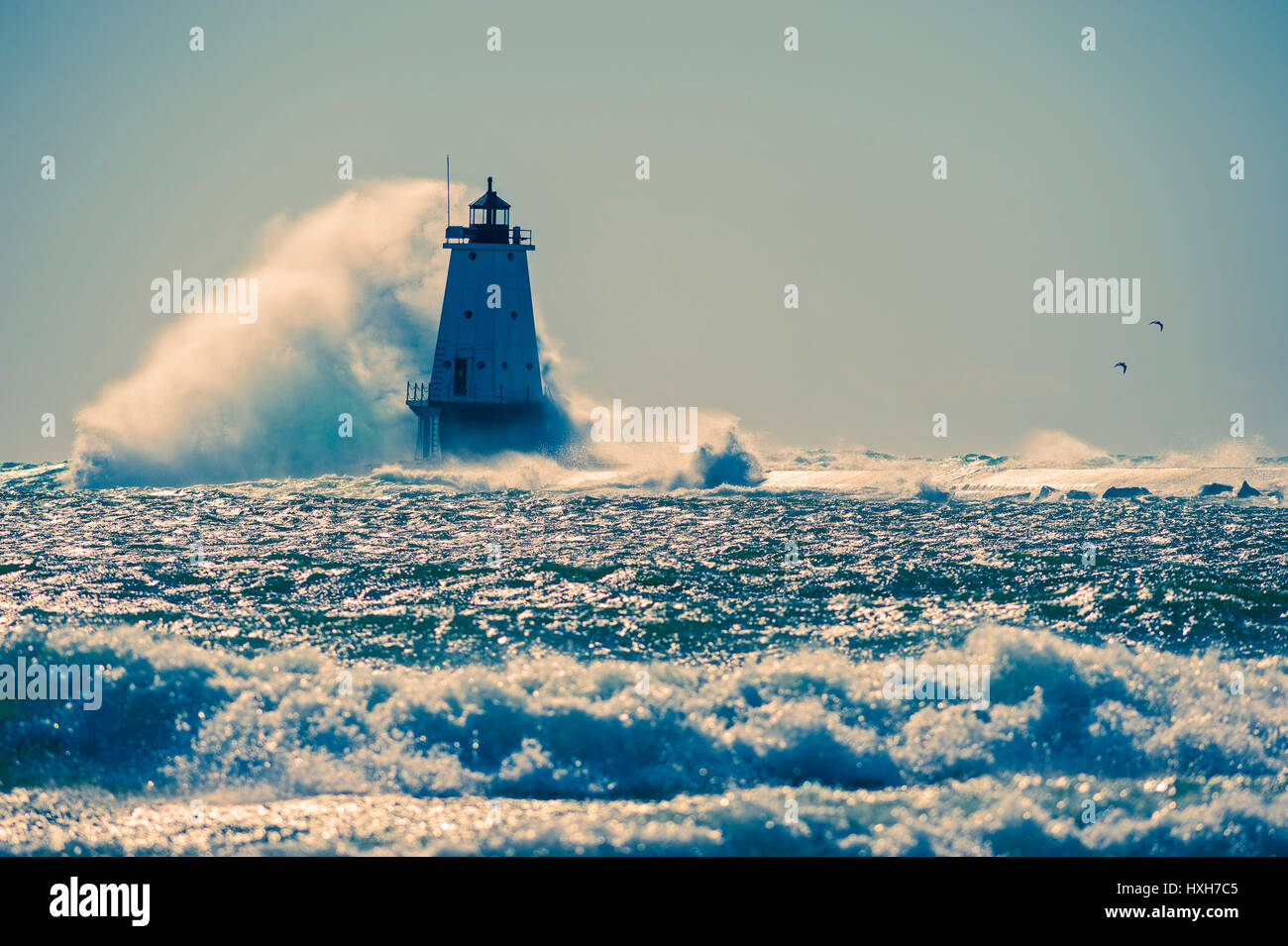 Wind whipped Lake Michigan crashing into the north break wall ...