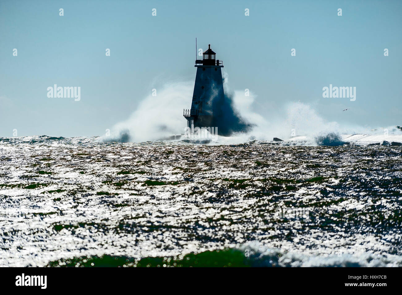 Wind whipped Lake Michigan crashing into the north break wall ...
