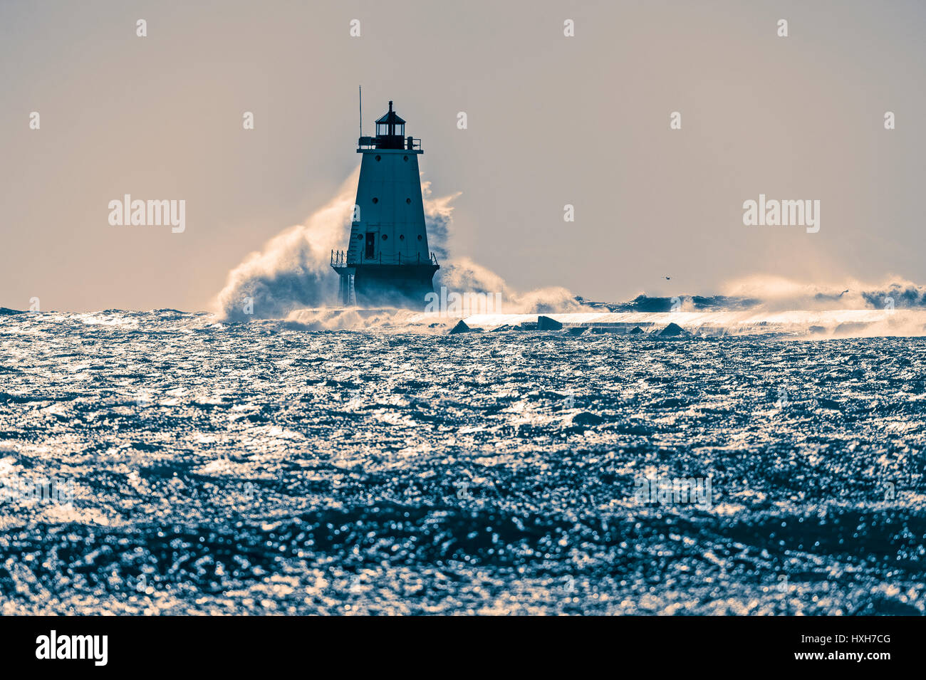 Wind whipped Lake Michigan crashing into the north break wall ...