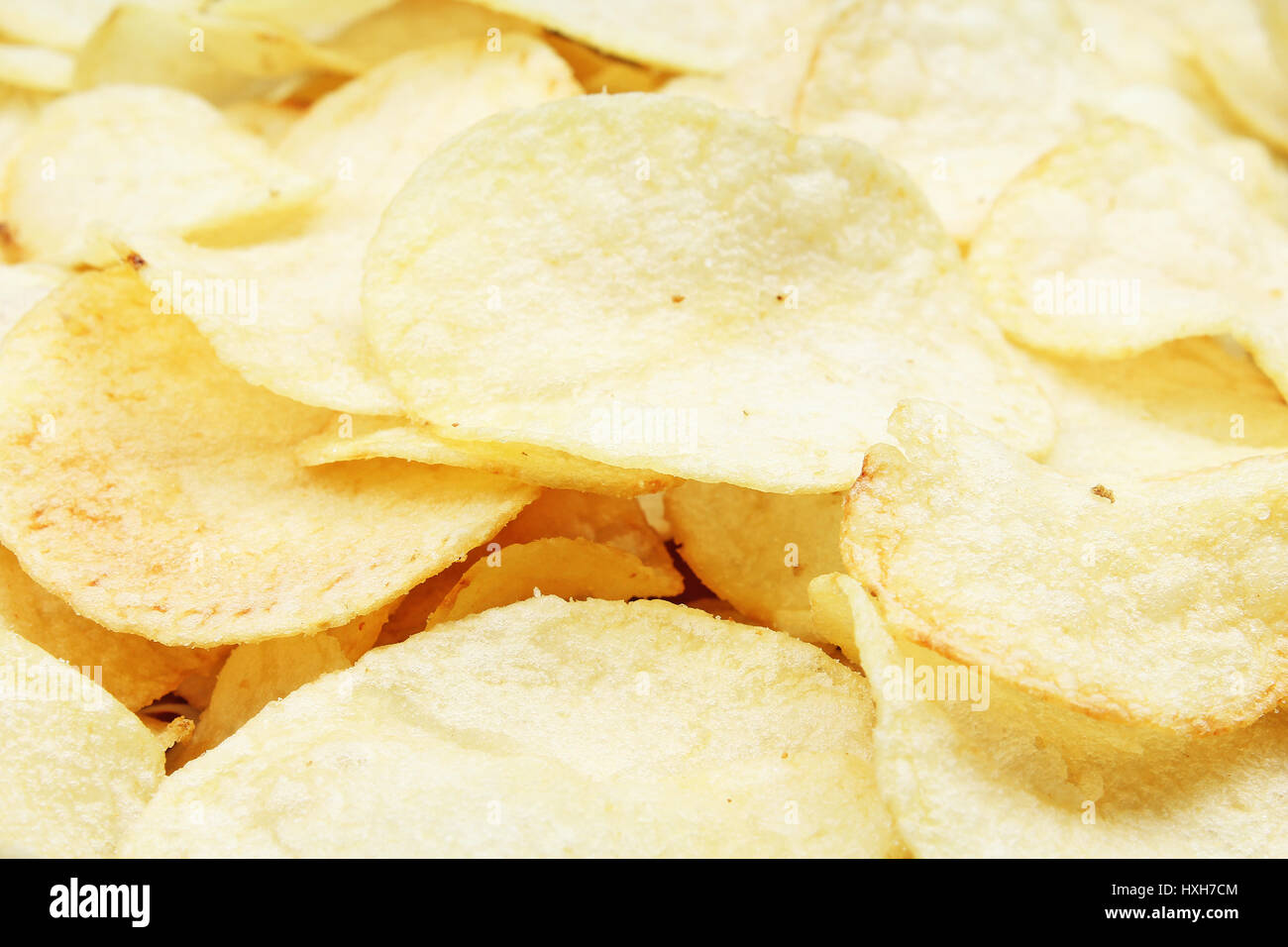 Chips pattern. Yellow salted potato chips as background. Chips texture ...