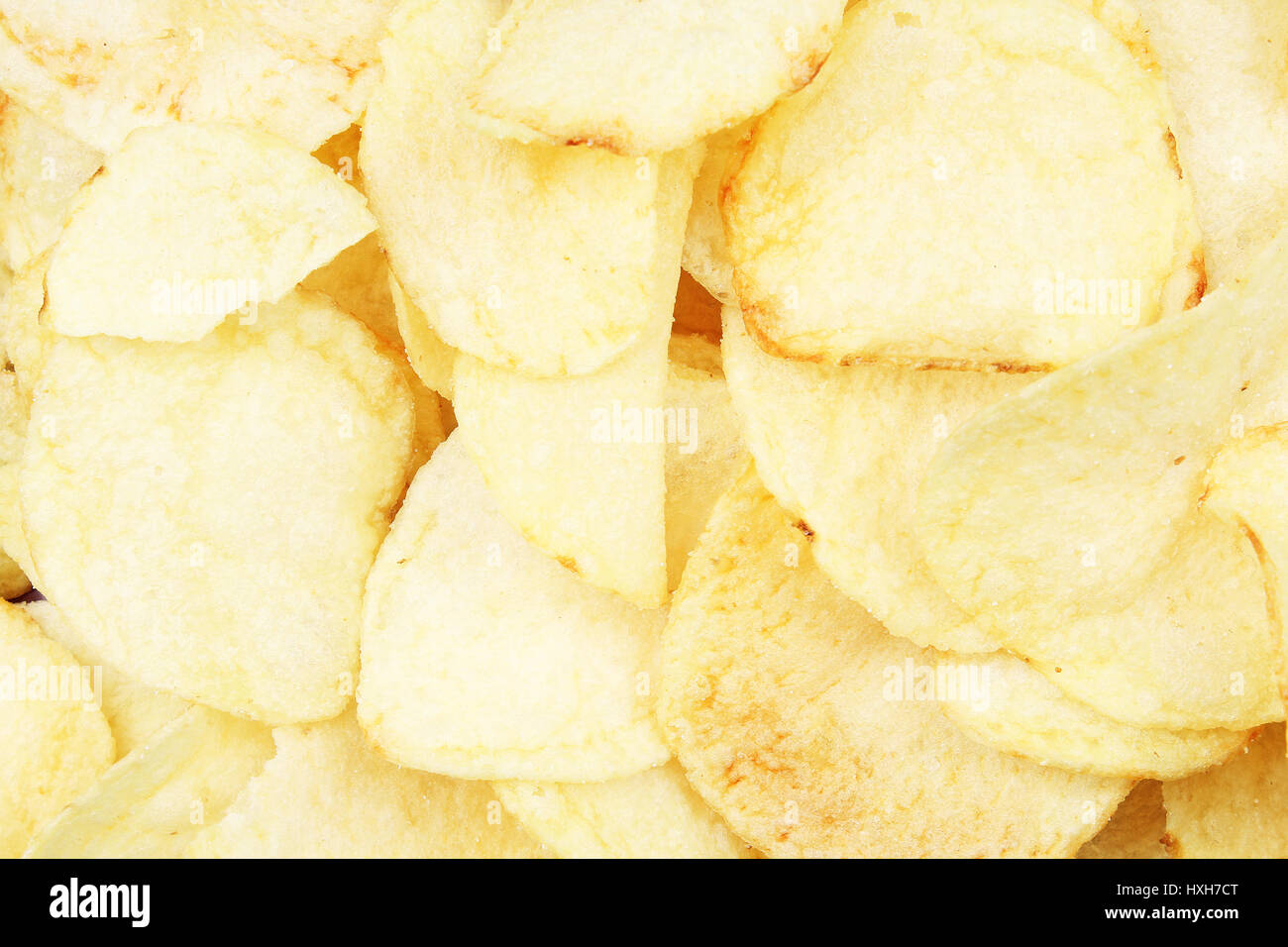 Chips pattern. Yellow salted potato chips as background. Chips texture ...