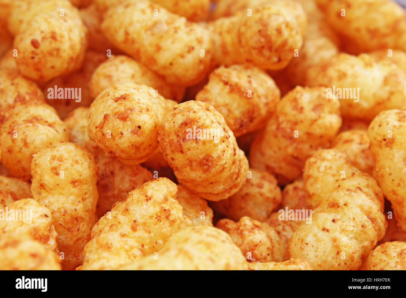 Cheese puff. Cheese puffs snack background texture food pattern Stock ...
